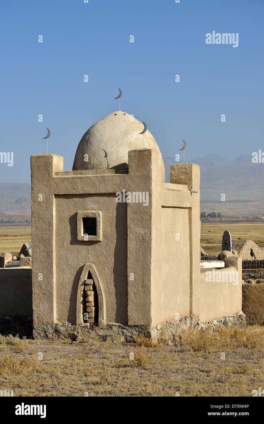 Tombs made of mud in a cemetery in village of Kara Too near Kochkor ...