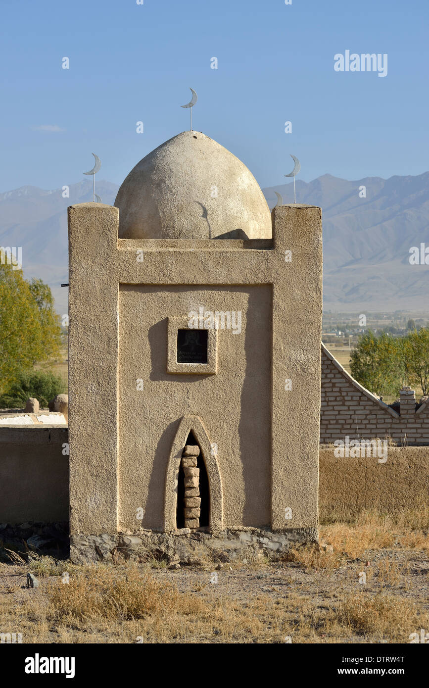 Tombs made of mud in a cemetery in village of Kara Too near Kochkor ...