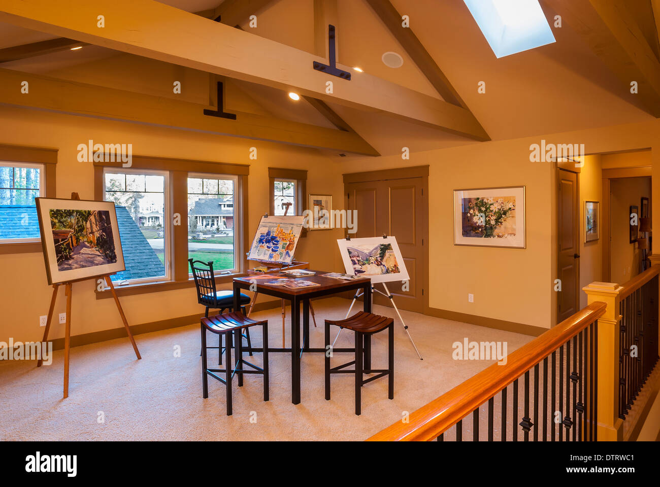 A loft with exposed beam is a feature in this luxury home with view of ...