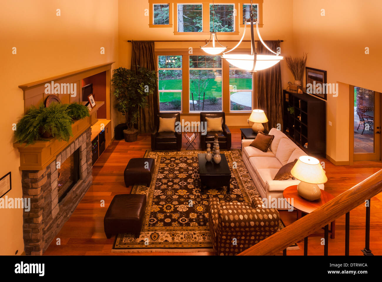 View of living room from upper part of staircase above, with view ...