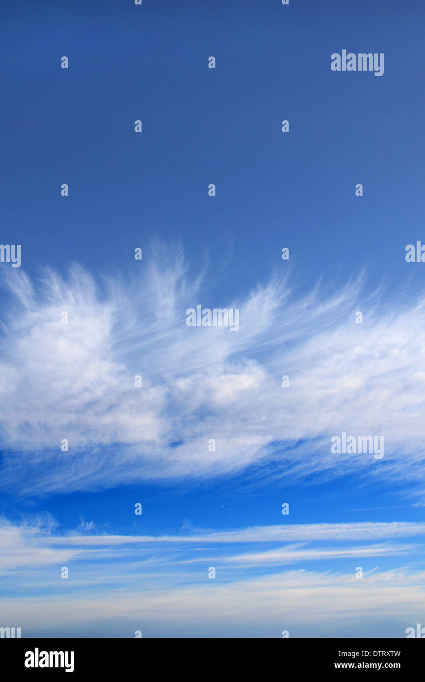 Blue sky with wispy clouds hi-res stock photography and images - Alamy