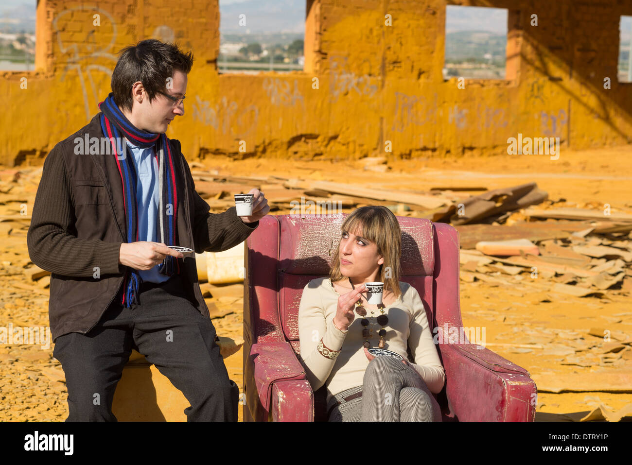 Posh people having tea time among industrial ruins, a concept Stock ...