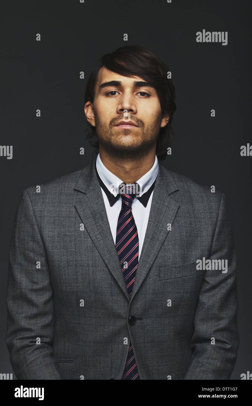 Serious young man suit hi-res stock photography and images - Alamy