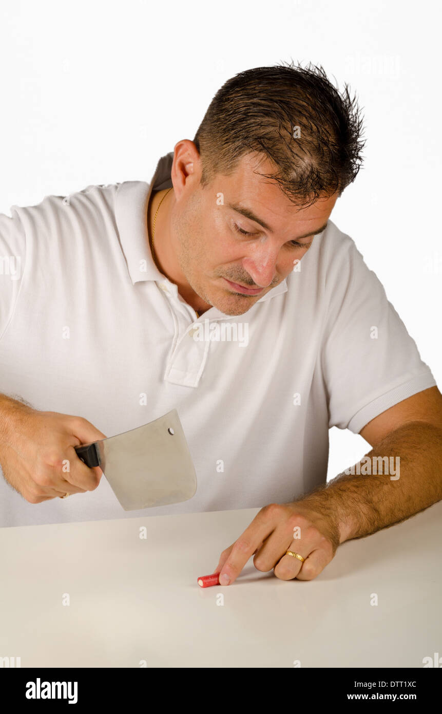 Size matters, a concept with a guy trying to chop a tiny thing with a ...
