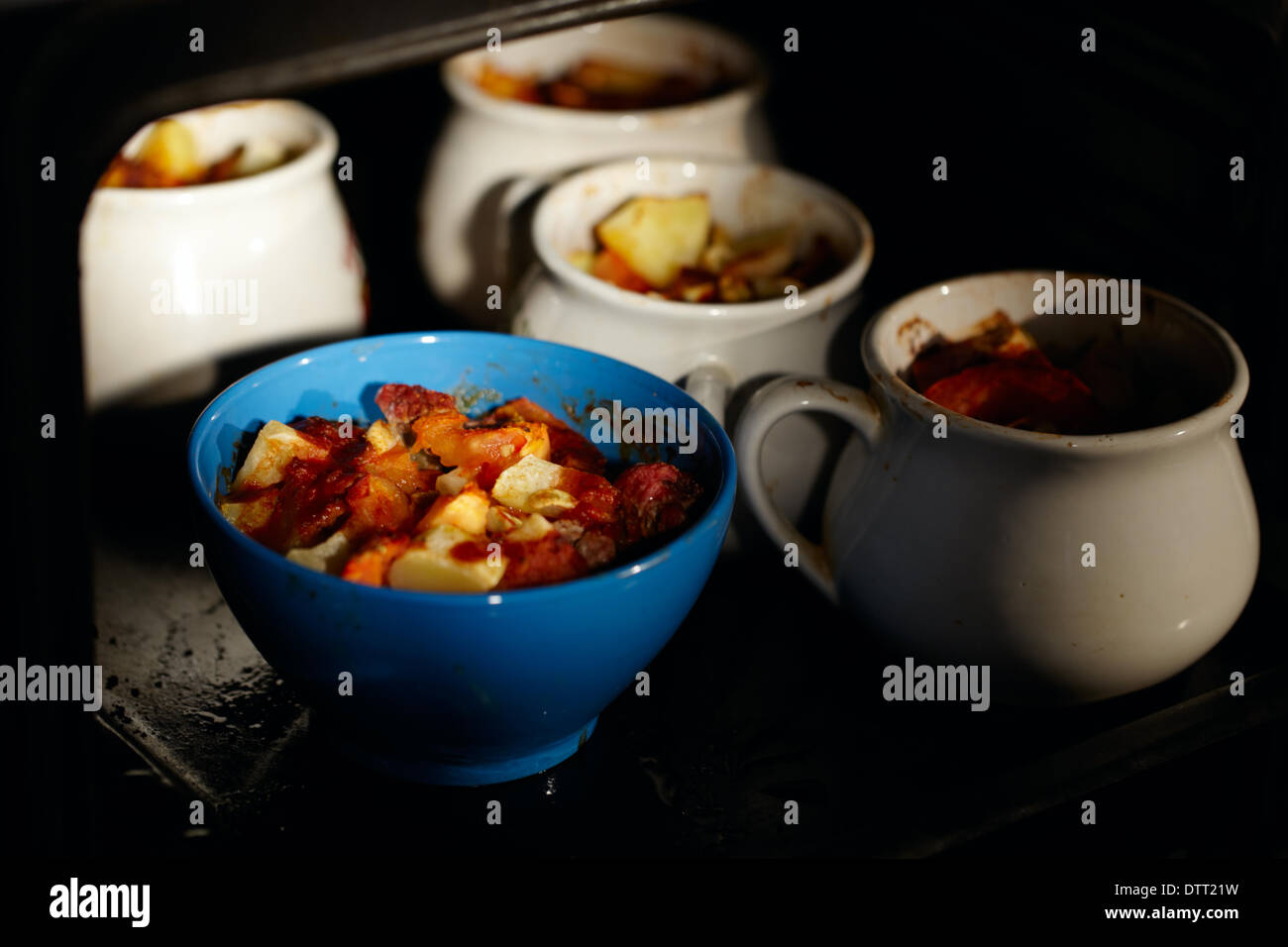 Mutton meat and potatoes, baked in pot Stock Photo - Alamy