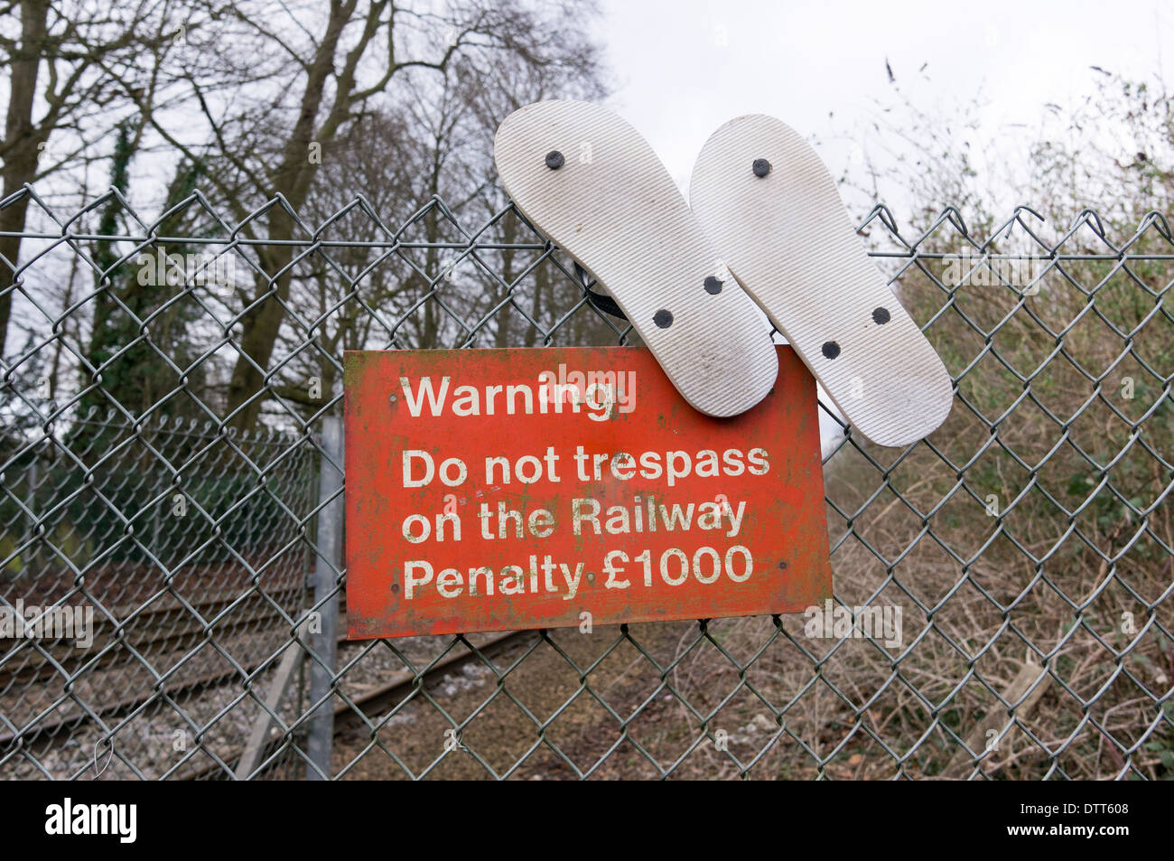 Shoes hanging on fence hi-res stock photography and images - Alamy