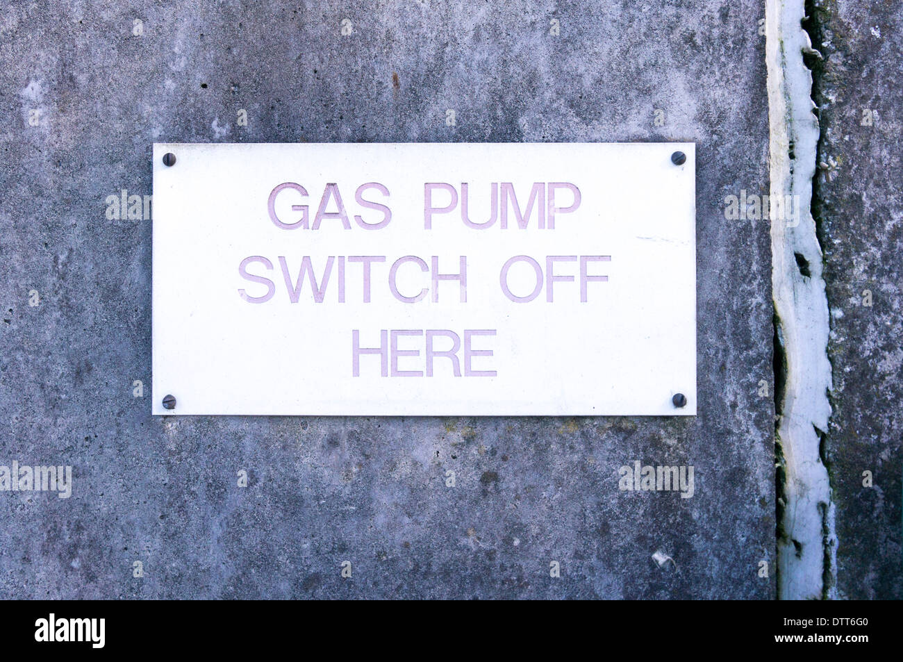 Gas pump switch off here safety sign Stock Photo - Alamy