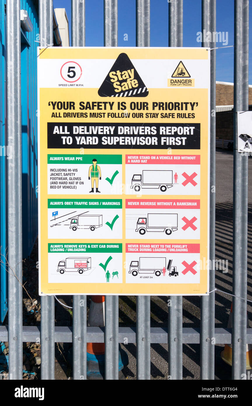 Safety notice on metal gate UK Stock Photo - Alamy