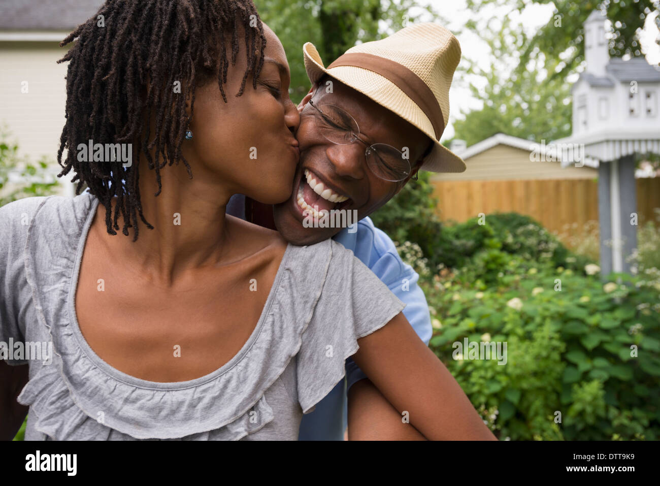 African American couple kissing in backyard Stock Photo - Alamy