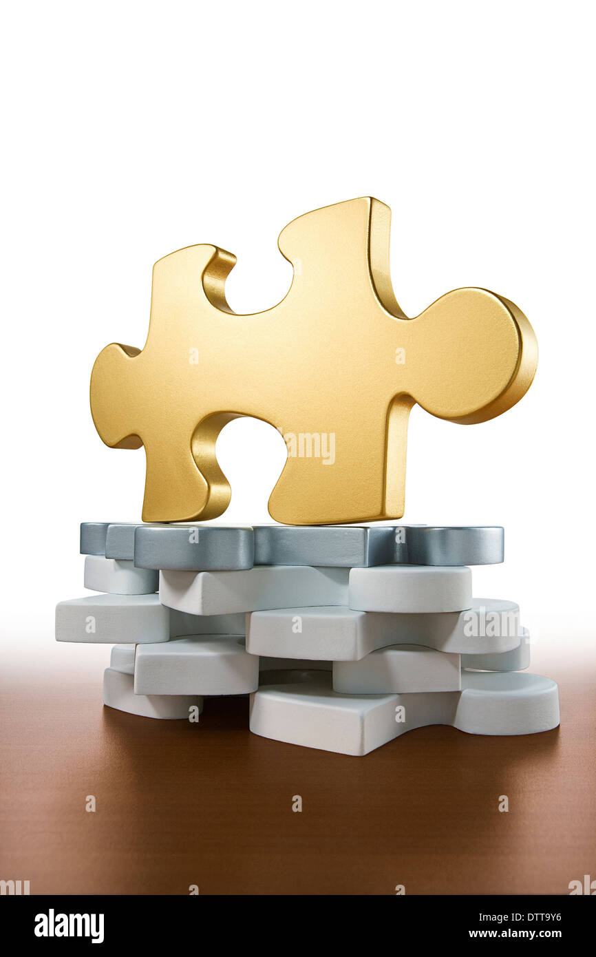 Gold puzzle piece hi-res stock photography and images - Alamy