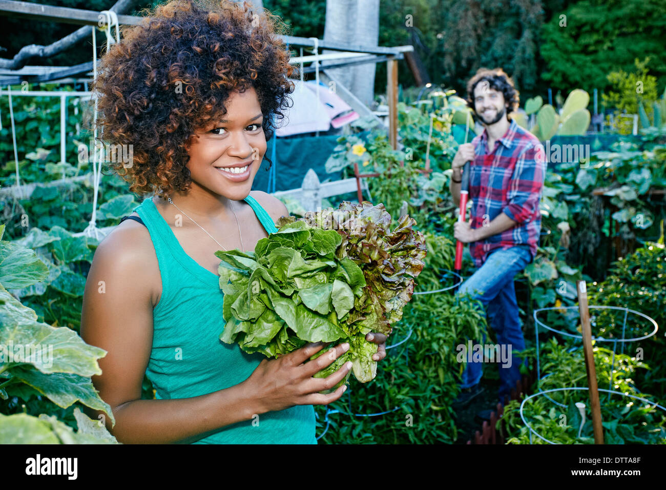 Couple working in garden Stock Photo - Alamy