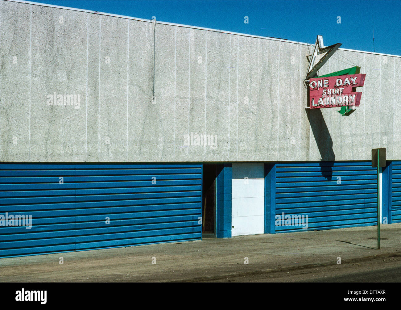 Streetside facade of commercial building housing a laundry service ...