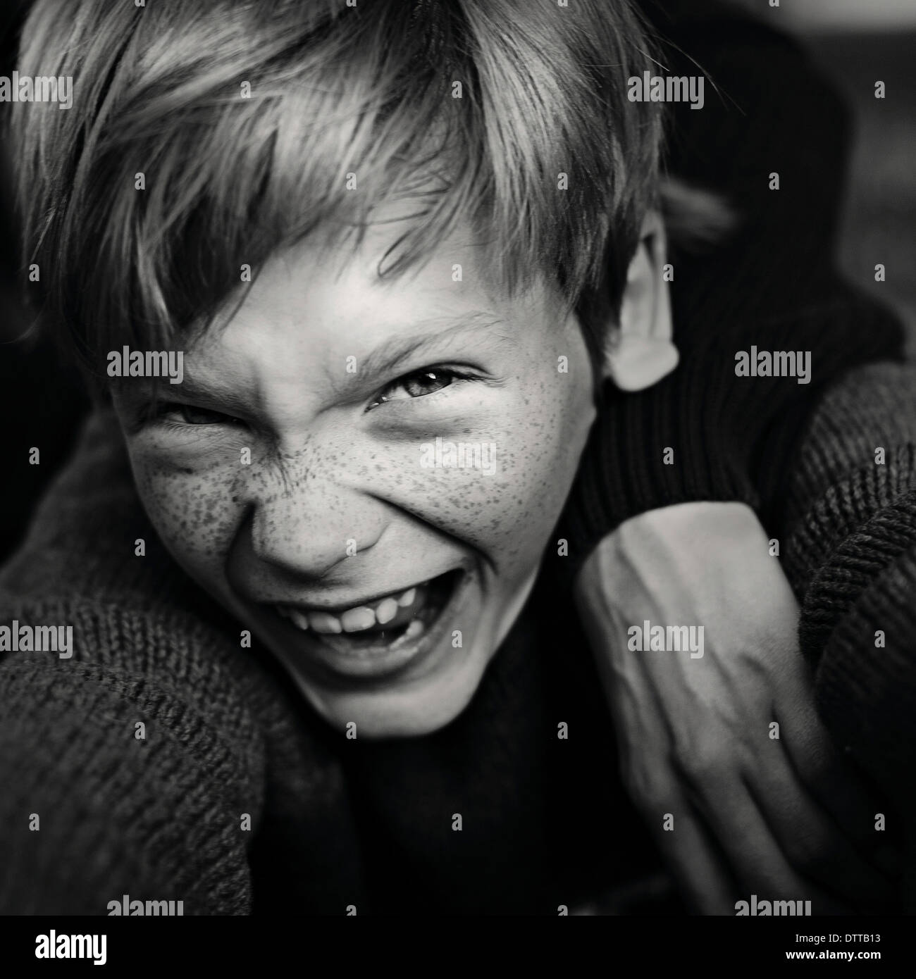 Caucasian boy with freckles laughing Stock Photo - Alamy