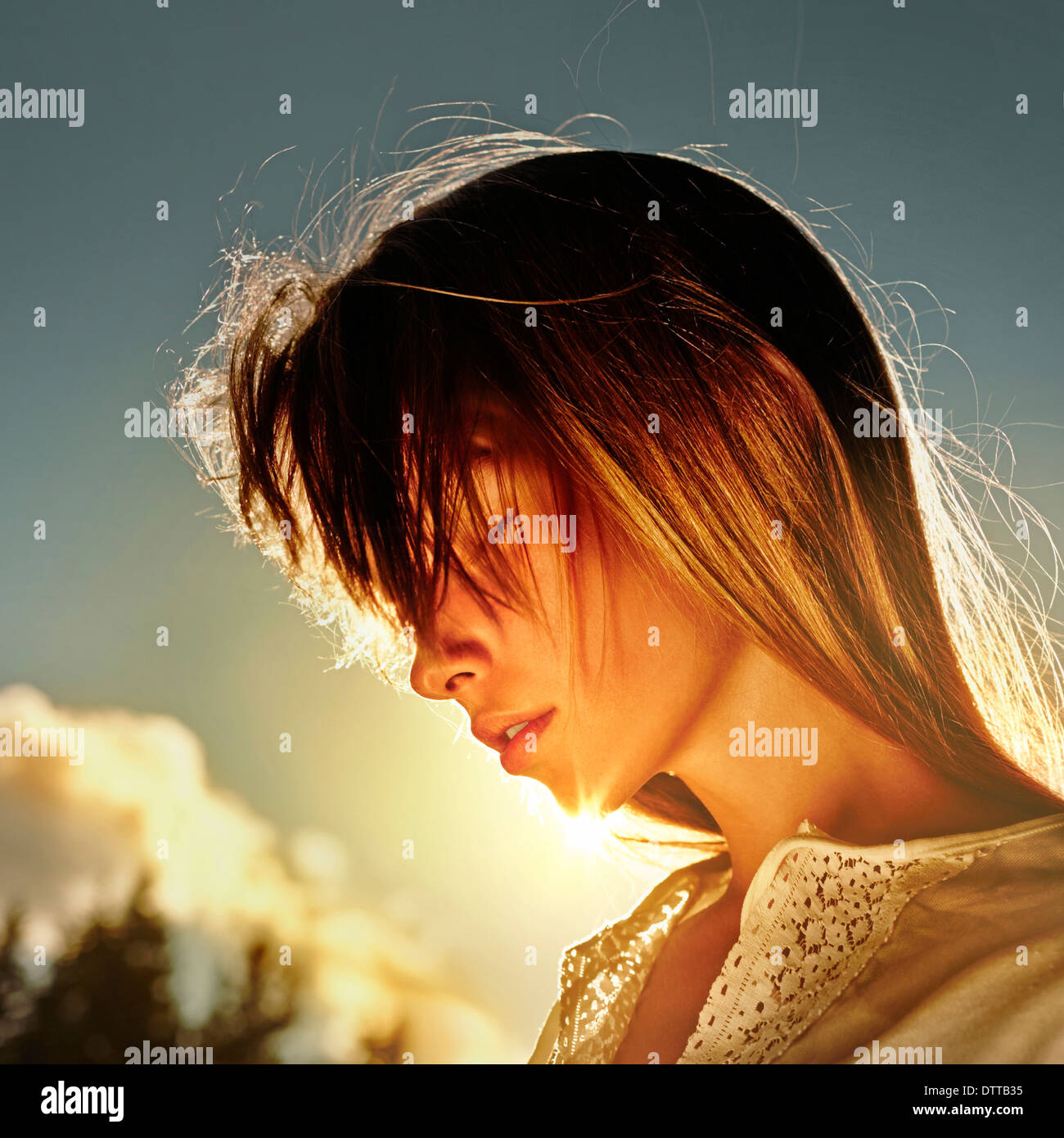 Caucasian girl standing in sun outdoors Stock Photo - Alamy