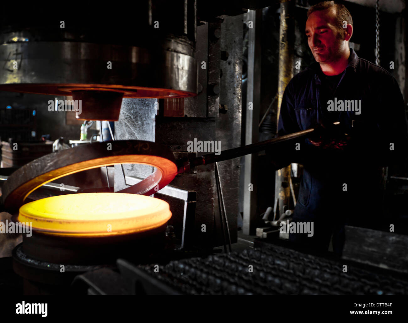 Caucasian worker melting steel in factory Stock Photo - Alamy