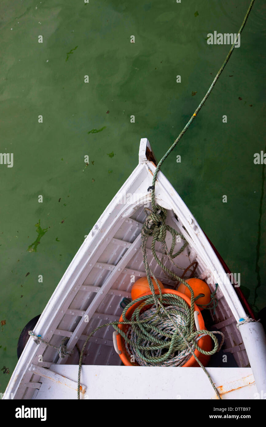 White Fishing boat bow seen from above with bucket and rope inside on ...