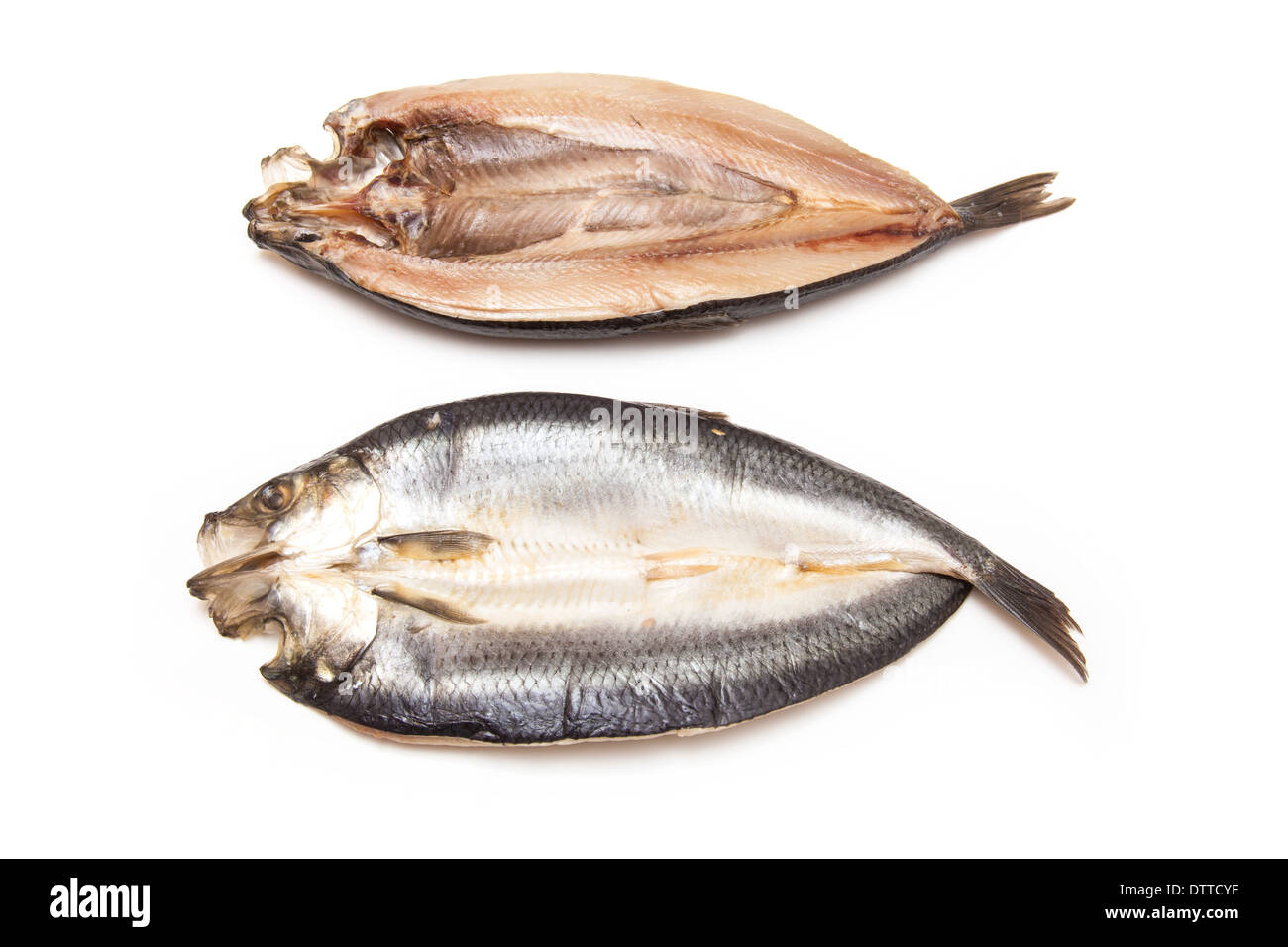 Non-dyed smoked Kippers isolated on a white studio background Stock ...