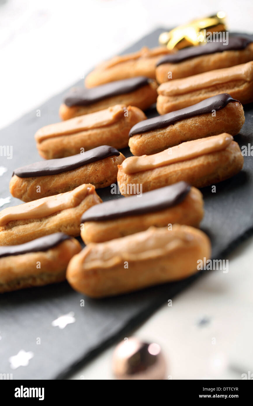 Coffee- and chocolate-éclairs (oblong pastry made with choux dough ...