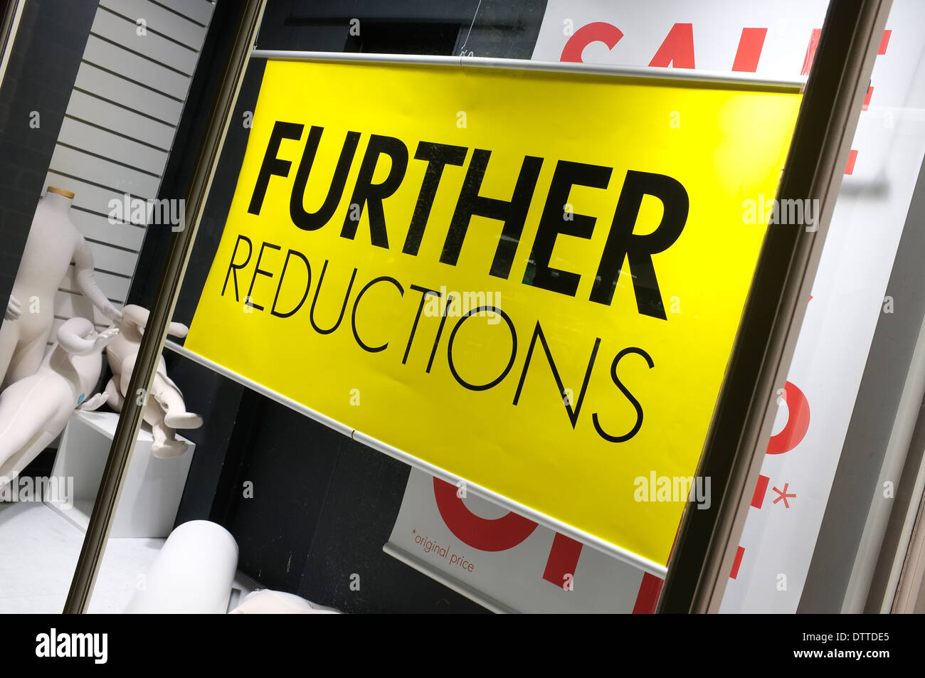 Yellow Further Reductions sign in shop window Stock Photo - Alamy