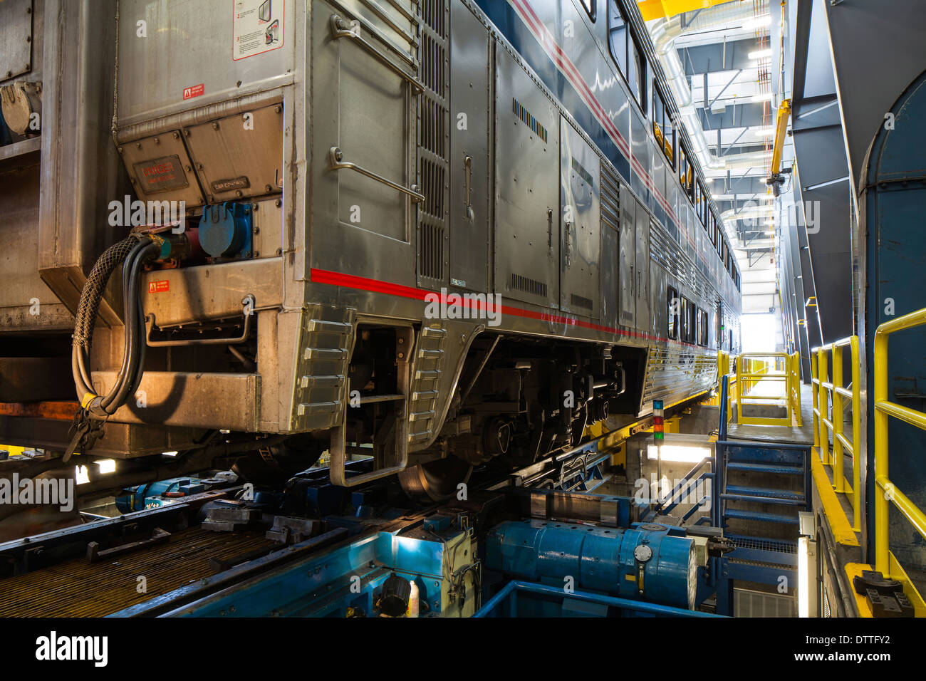Train parked in maintenance facility Stock Photo - Alamy