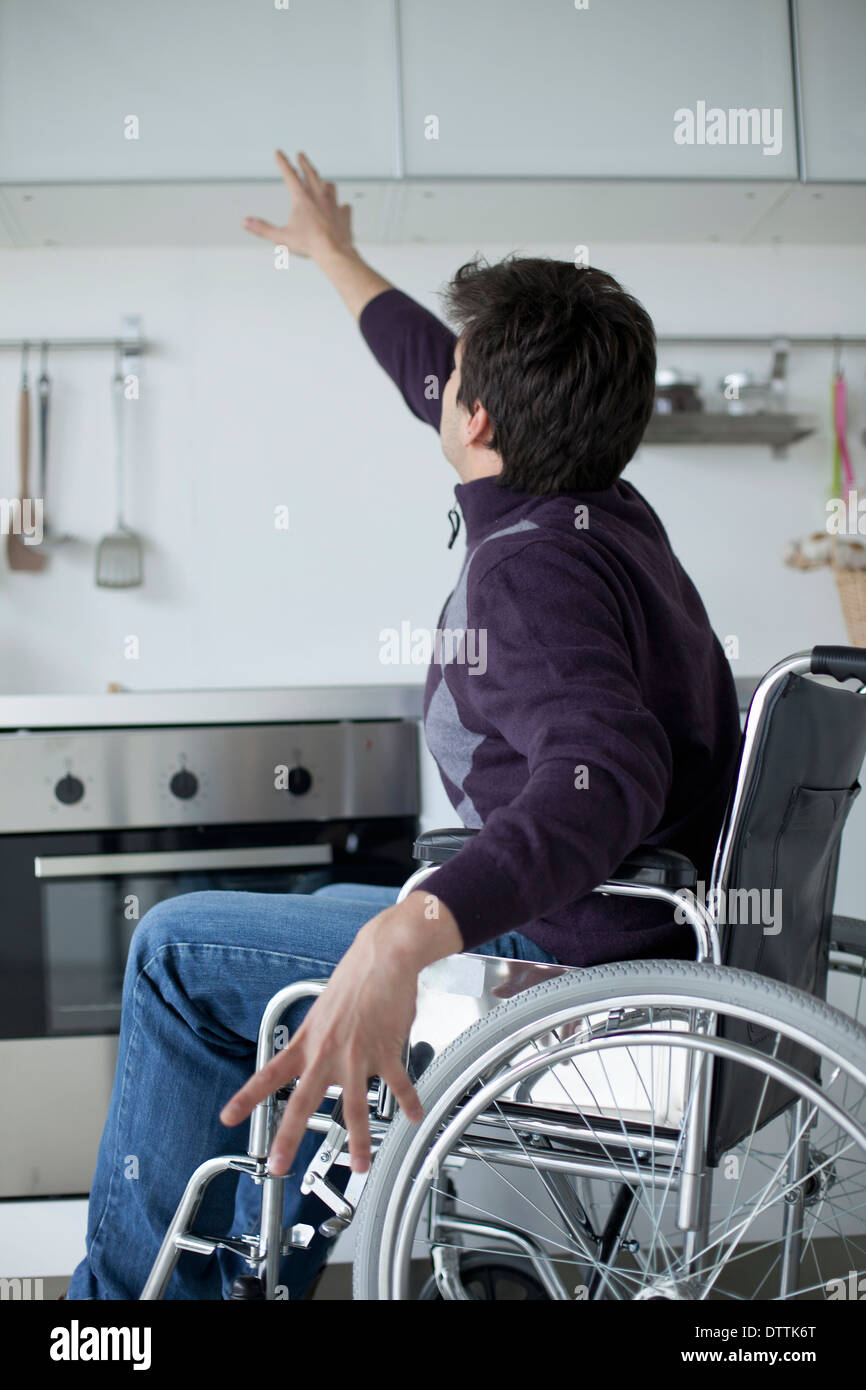 Reaching into cupboard hi-res stock photography and images - Alamy