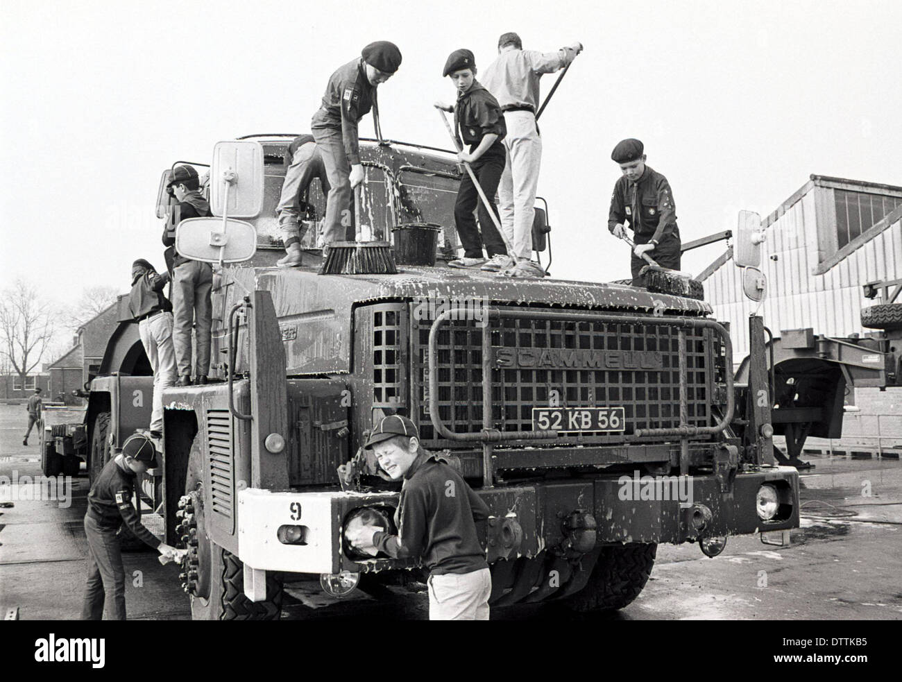 Scouts clean an army tank transporter at Tidworth Army camp in ...