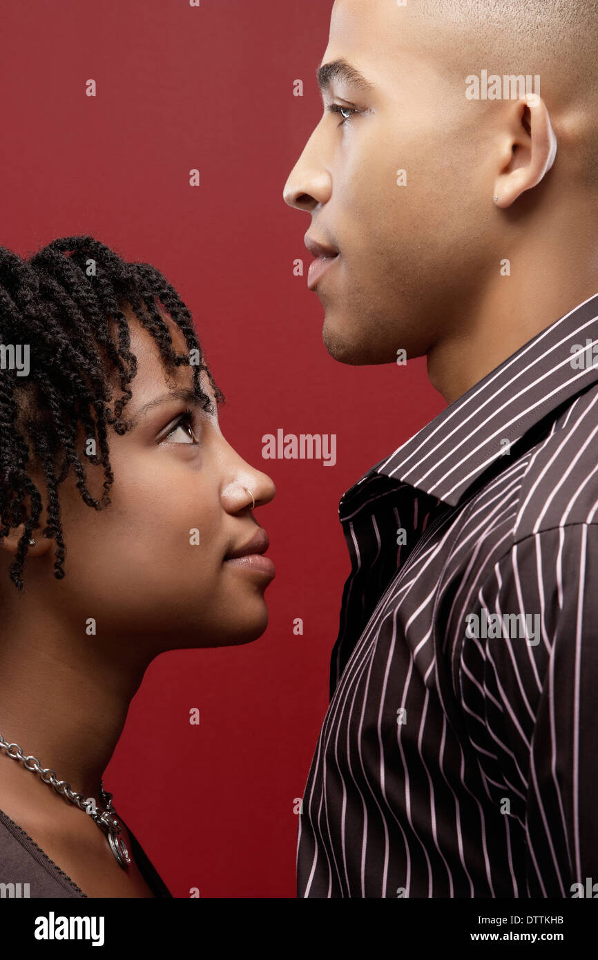 Woman looking up at boyfriend Stock Photo - Alamy