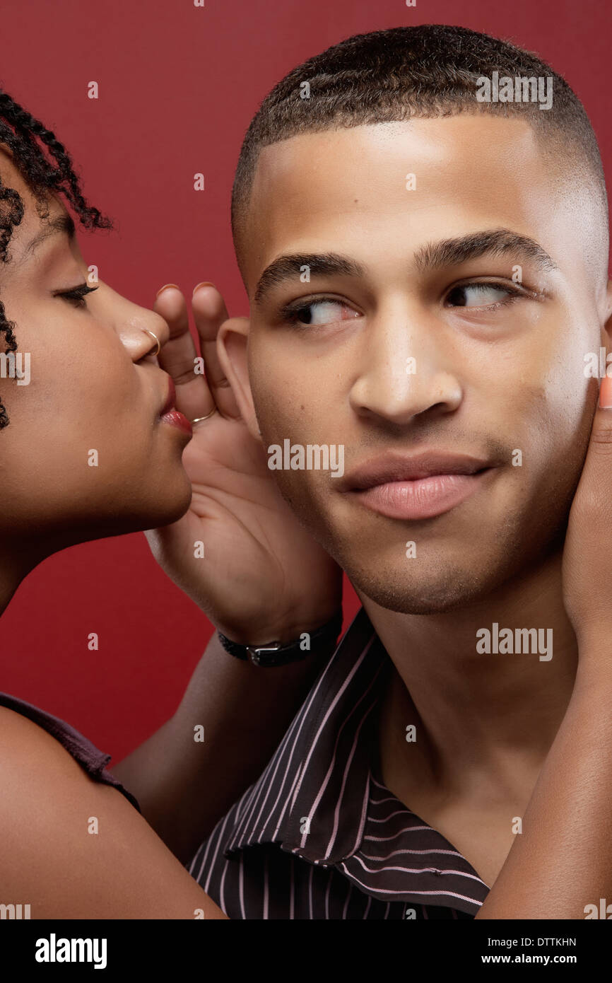 Woman holding camera whispering secret hi-res stock photography and ...