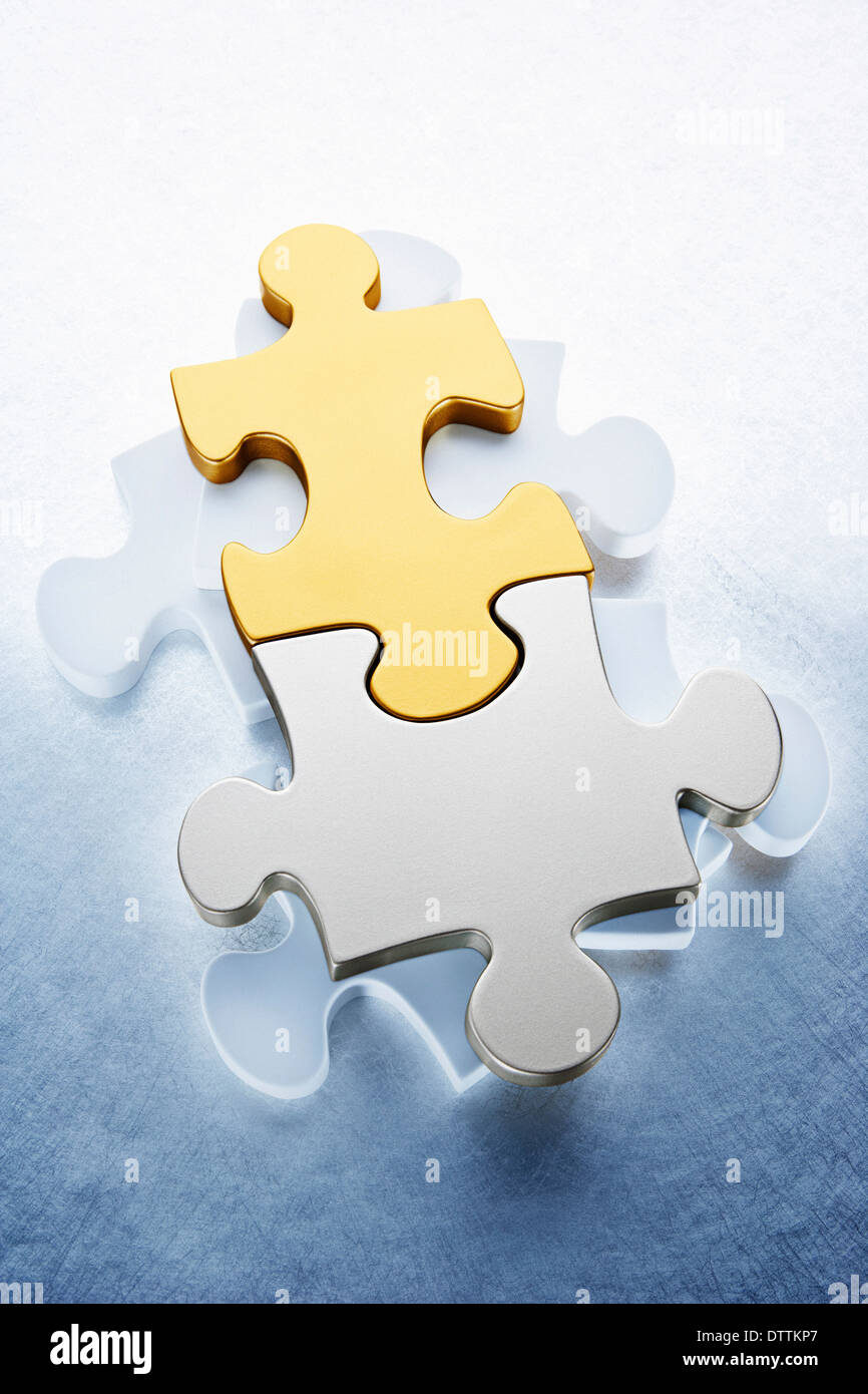Gold jigsaw puzzle hi-res stock photography and images - Alamy