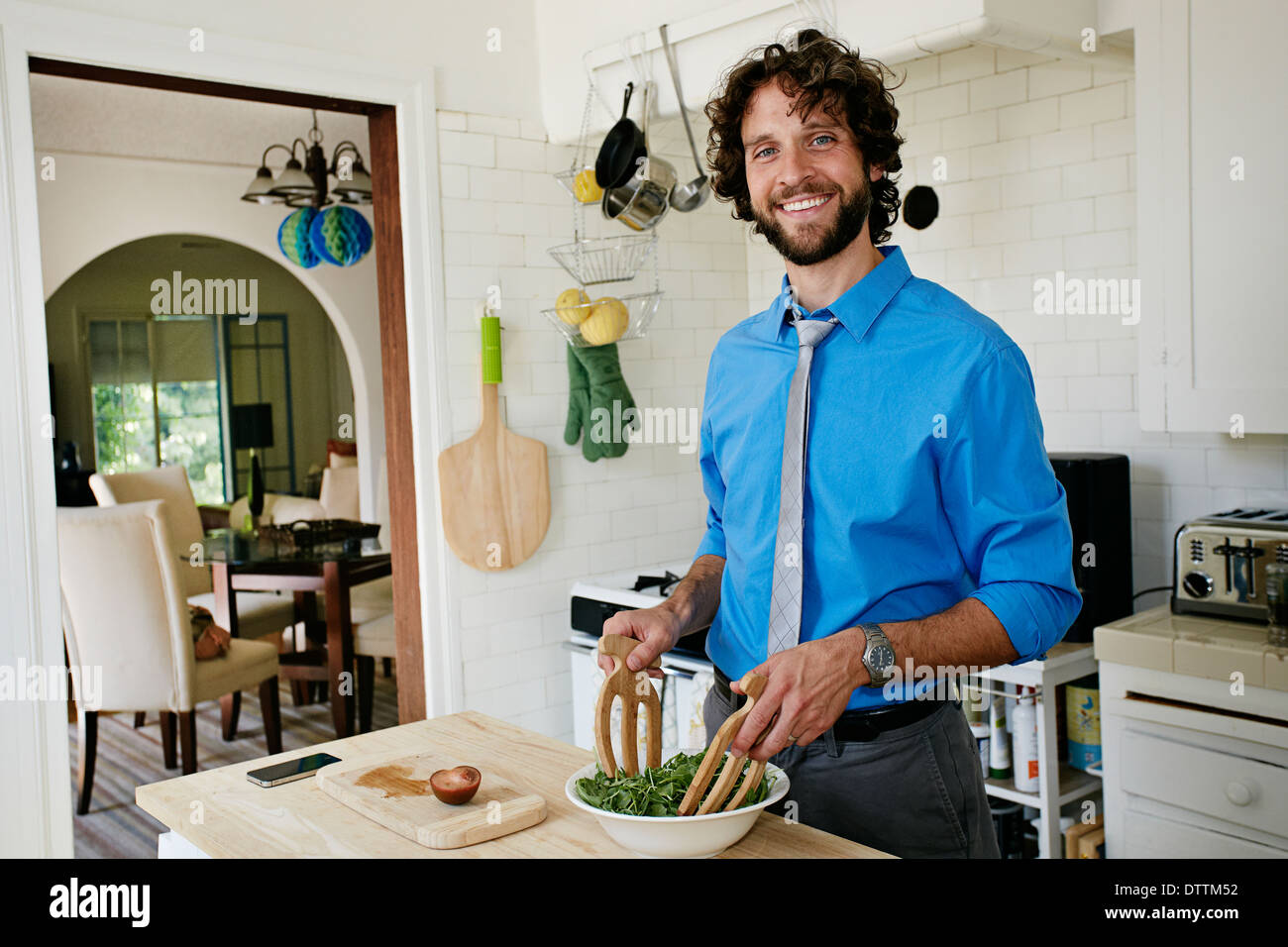 Caucasian businessman cooking in kitchen Stock Photo - Alamy