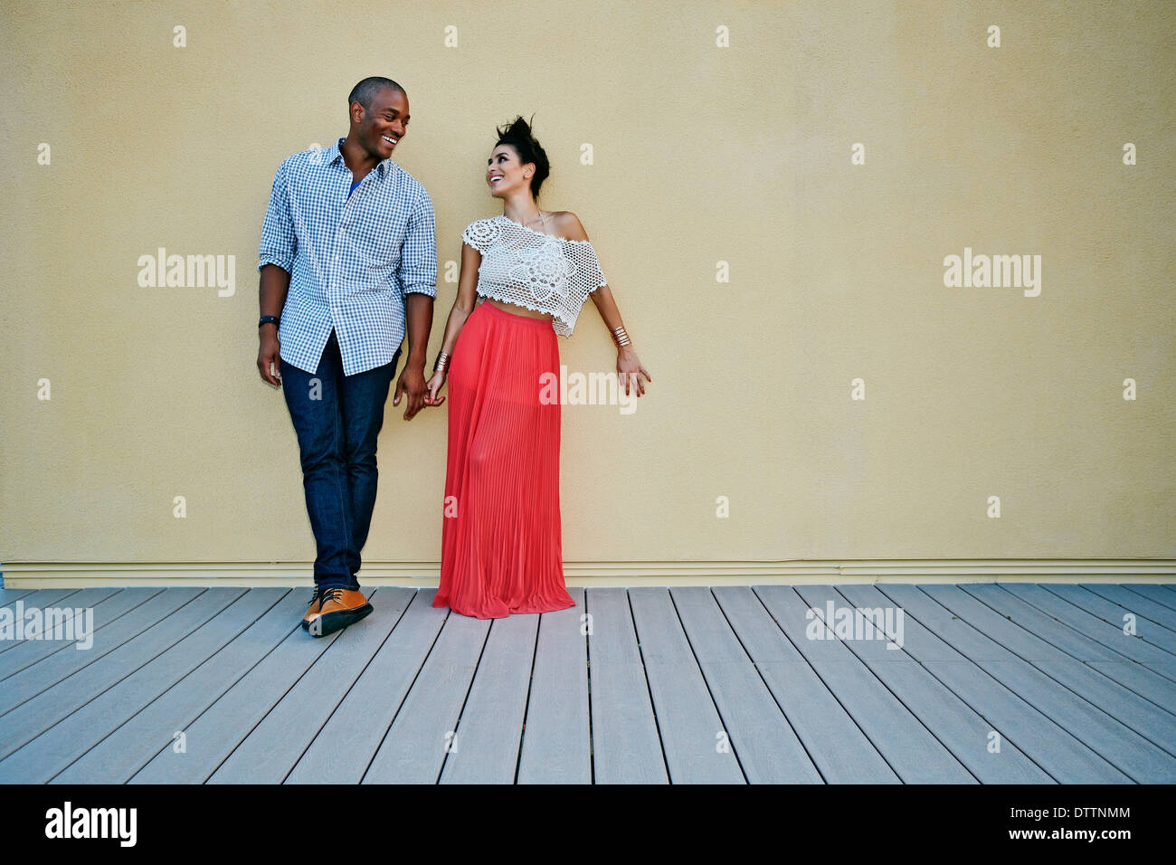 Group of people standing against wall hi-res stock photography and ...