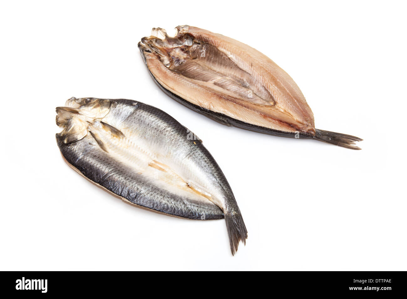 Non-dyed smoked Kippers isolated on a white studio background Stock ...
