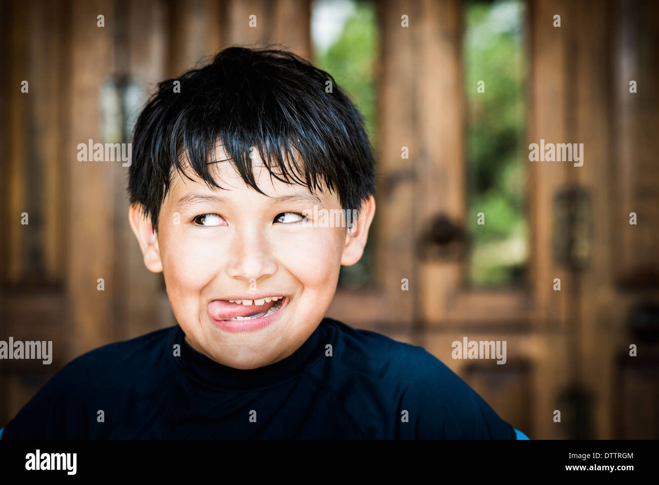 Hispanic boy making face Stock Photo - Alamy