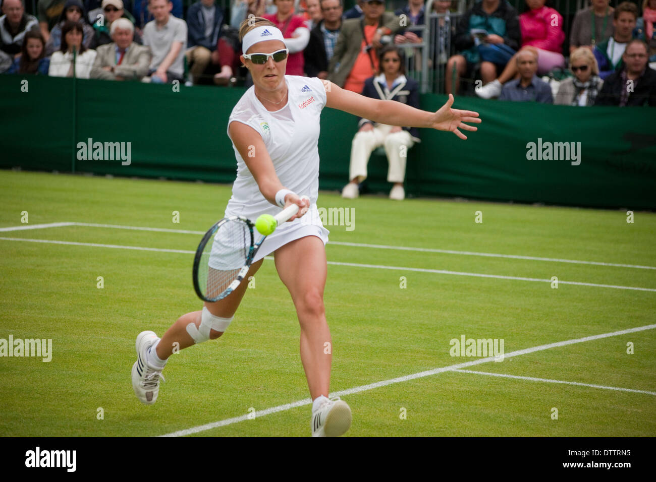 Female tennis player returning shot at wimbledon tennis championship hi ...
