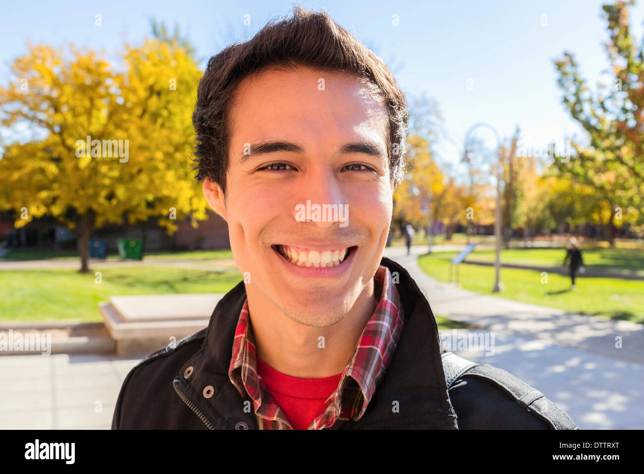 Student smiling on campus Stock Photo - Alamy