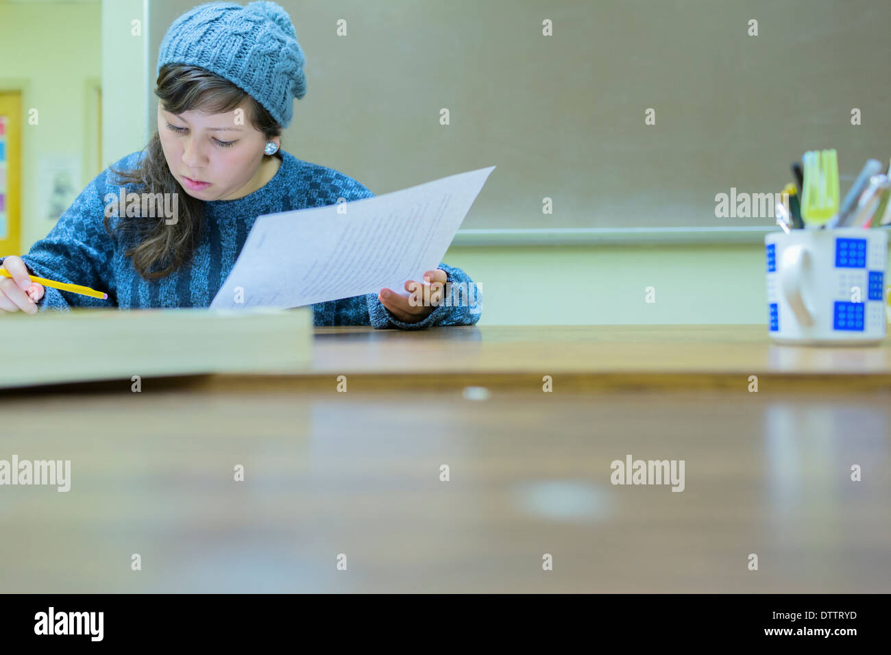 Hispanic student working in classroom Stock Photo - Alamy