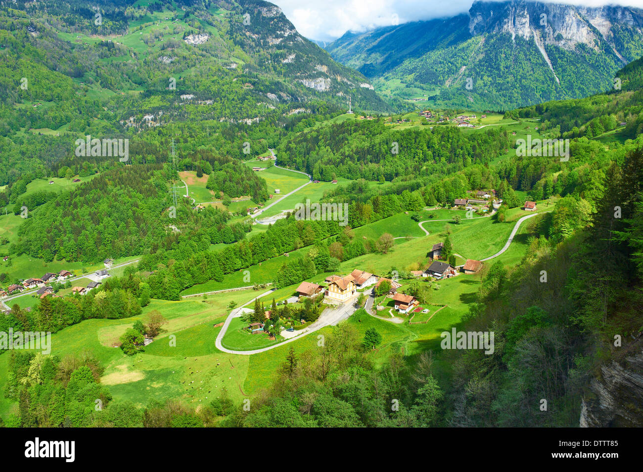 Swiss village at Alps Stock Photo - Alamy