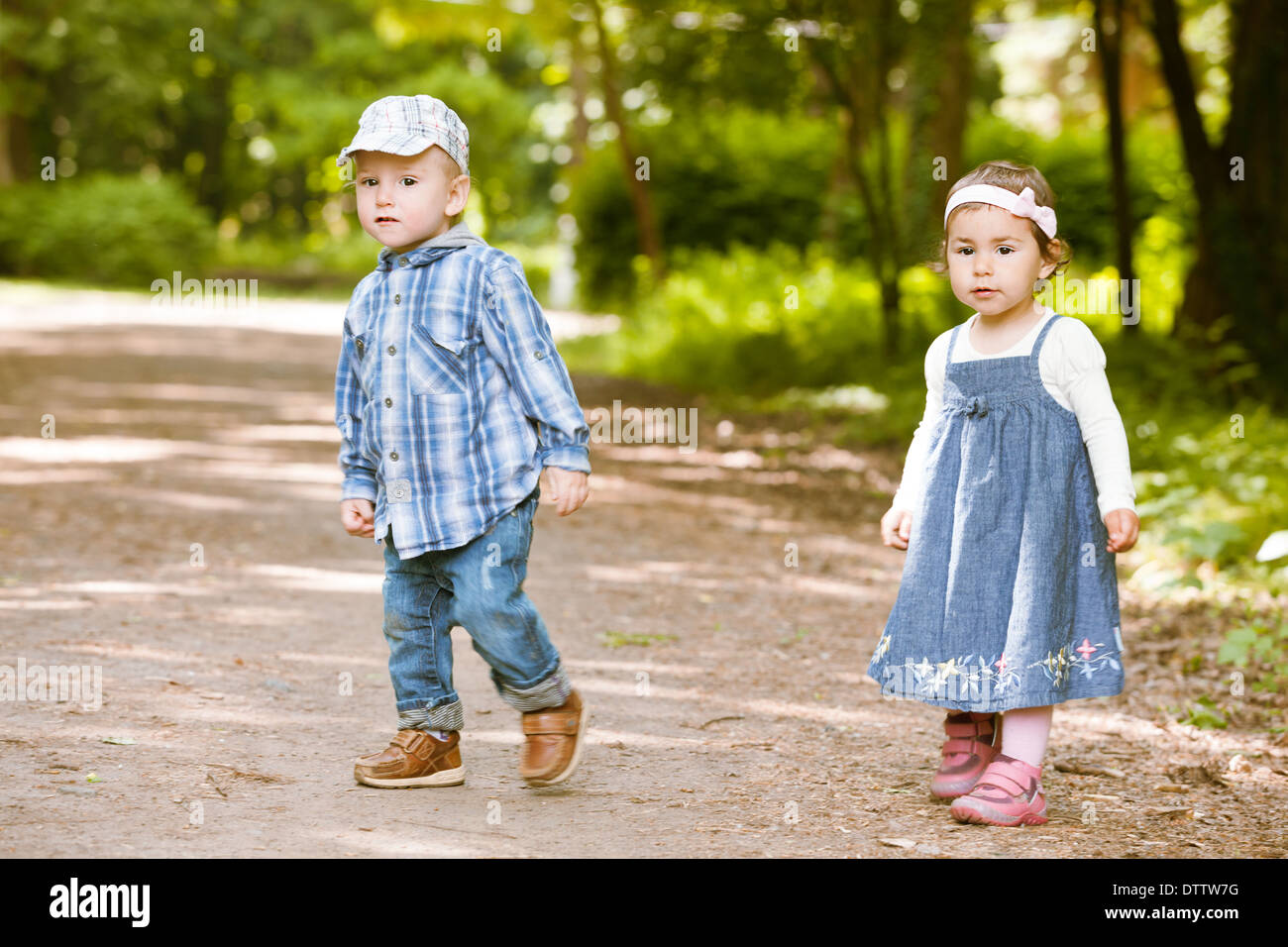 Boy and girl are playing win park outdoor Stock Photo - Alamy