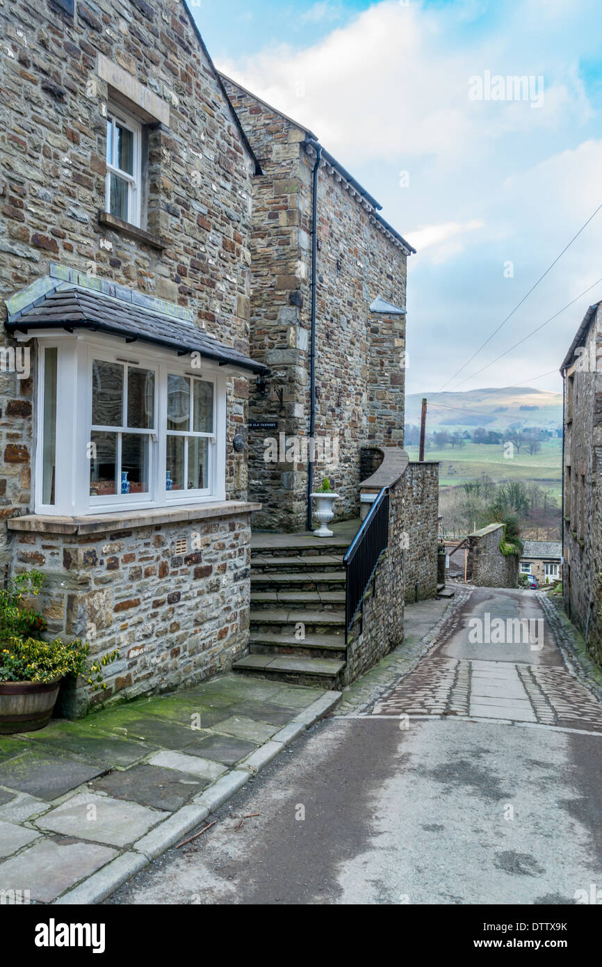 Stone built cottage with steps leading up to front entrance Stock Photo ...