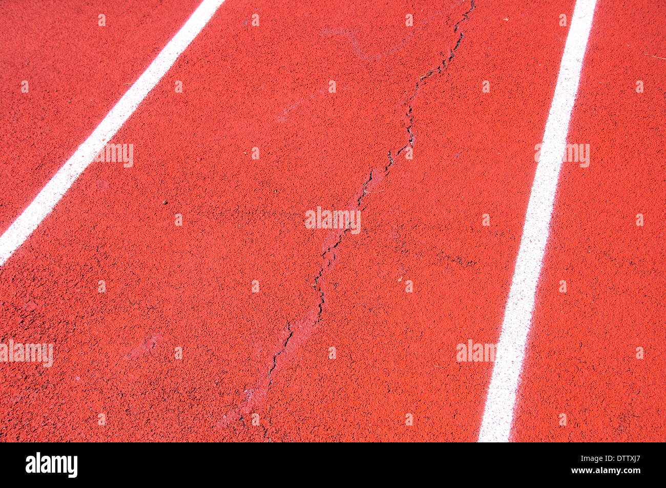 An old running track with crack at school Stock Photo - Alamy