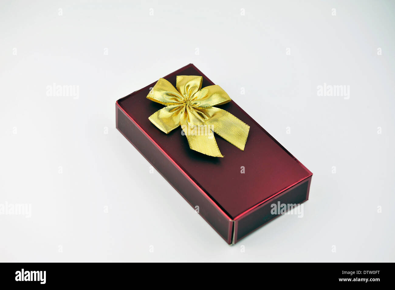Gift box wrapped with ribbon Stock Photo - Alamy