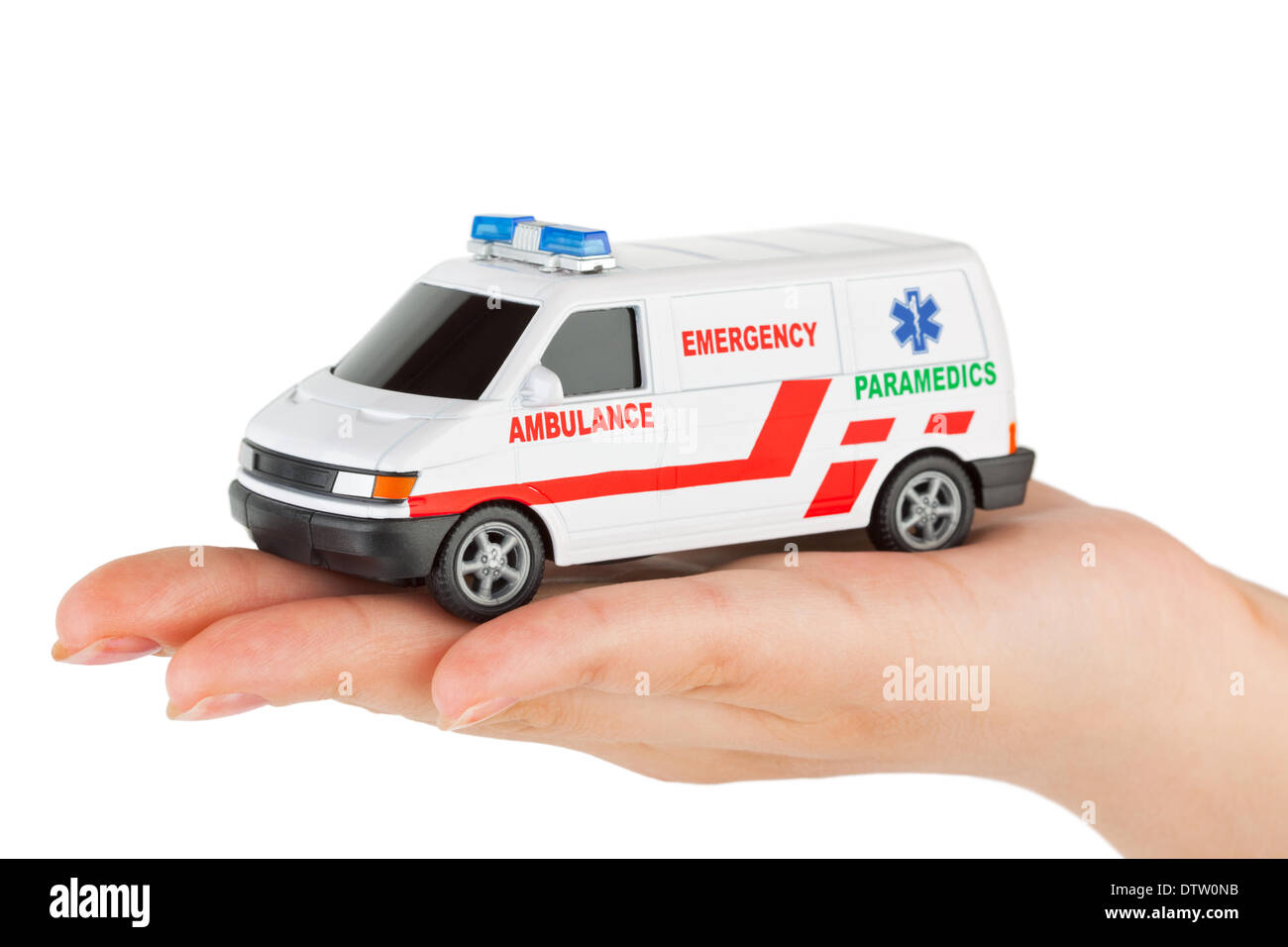 Hand with toy ambulance car Stock Photo - Alamy