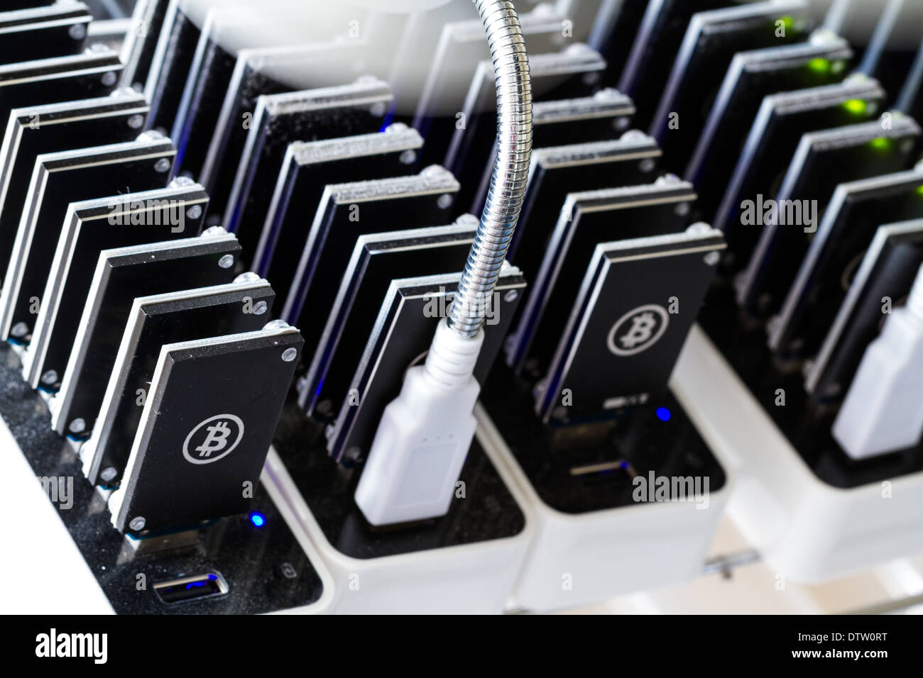 Bitcoin mining USB devices in a row with small fans Stock Photo - Alamy