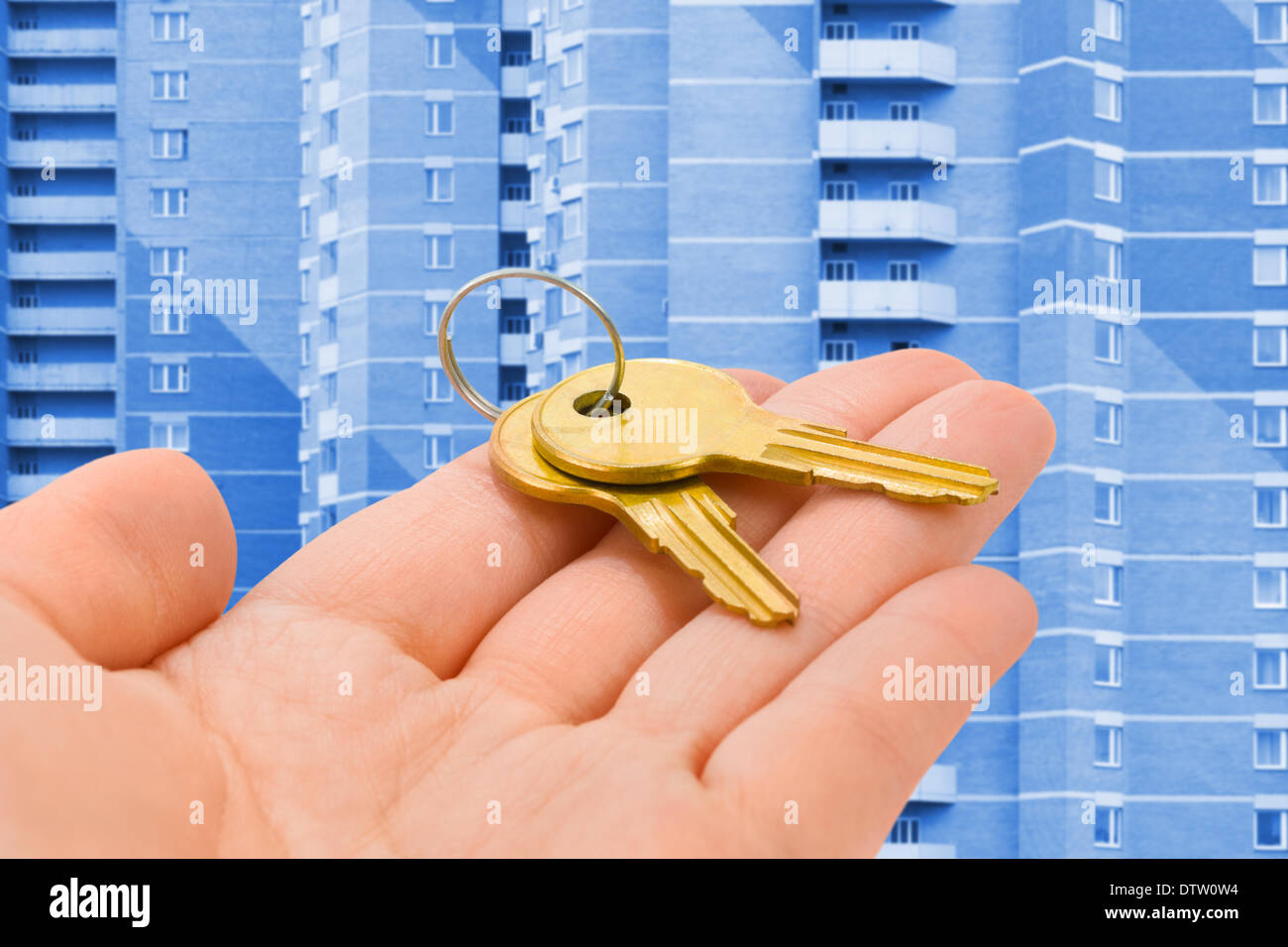 Hand giving keys Stock Photo - Alamy