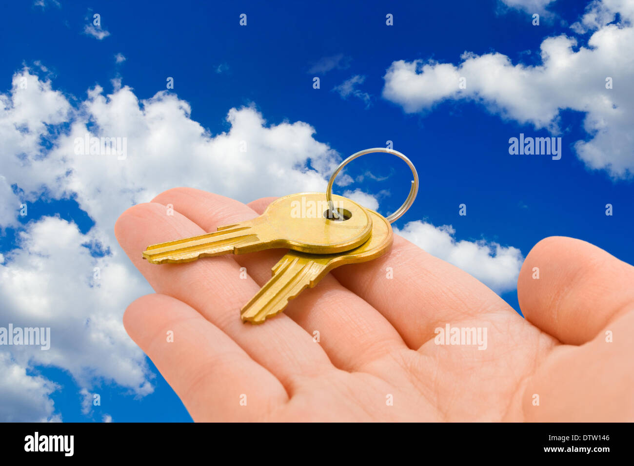 Hand giving keys Stock Photo - Alamy