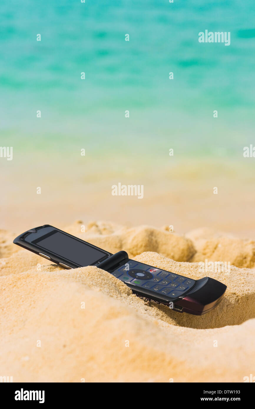 On mobile on beach hi-res stock photography and images - Alamy