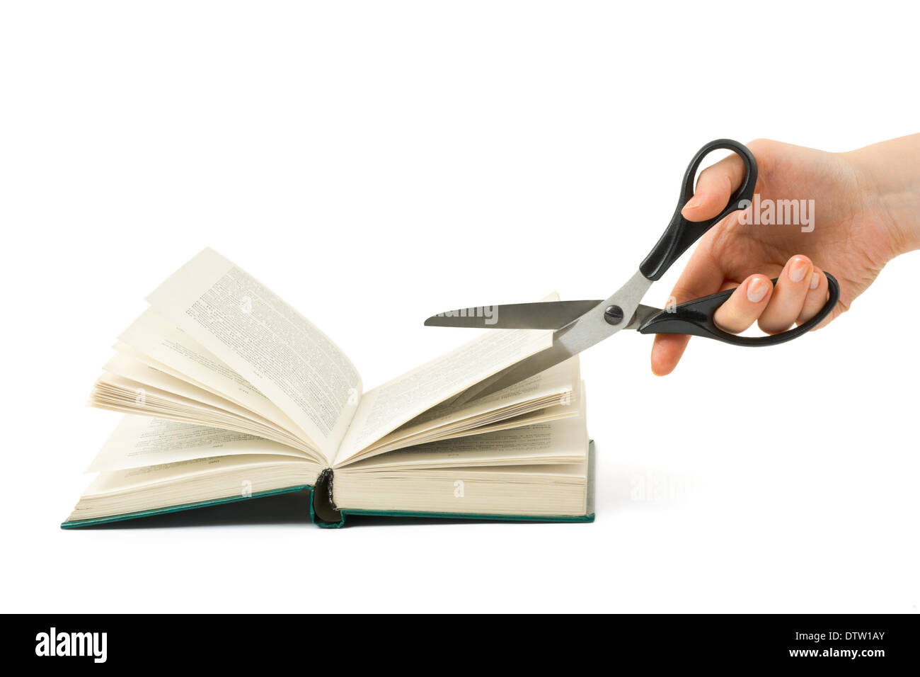 Hand with scissors cutting book Stock Photo - Alamy