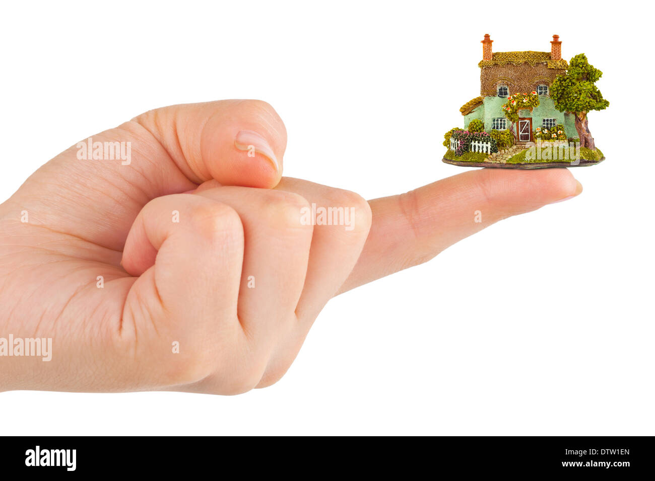 Hand and small house Stock Photo - Alamy
