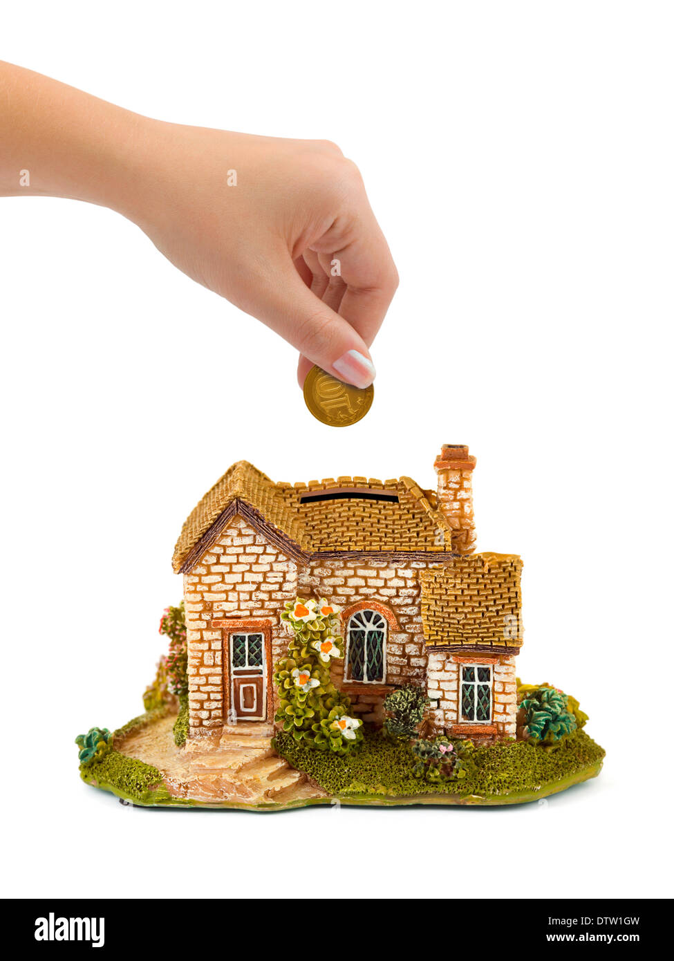 Hand with coin and house bank Stock Photo - Alamy