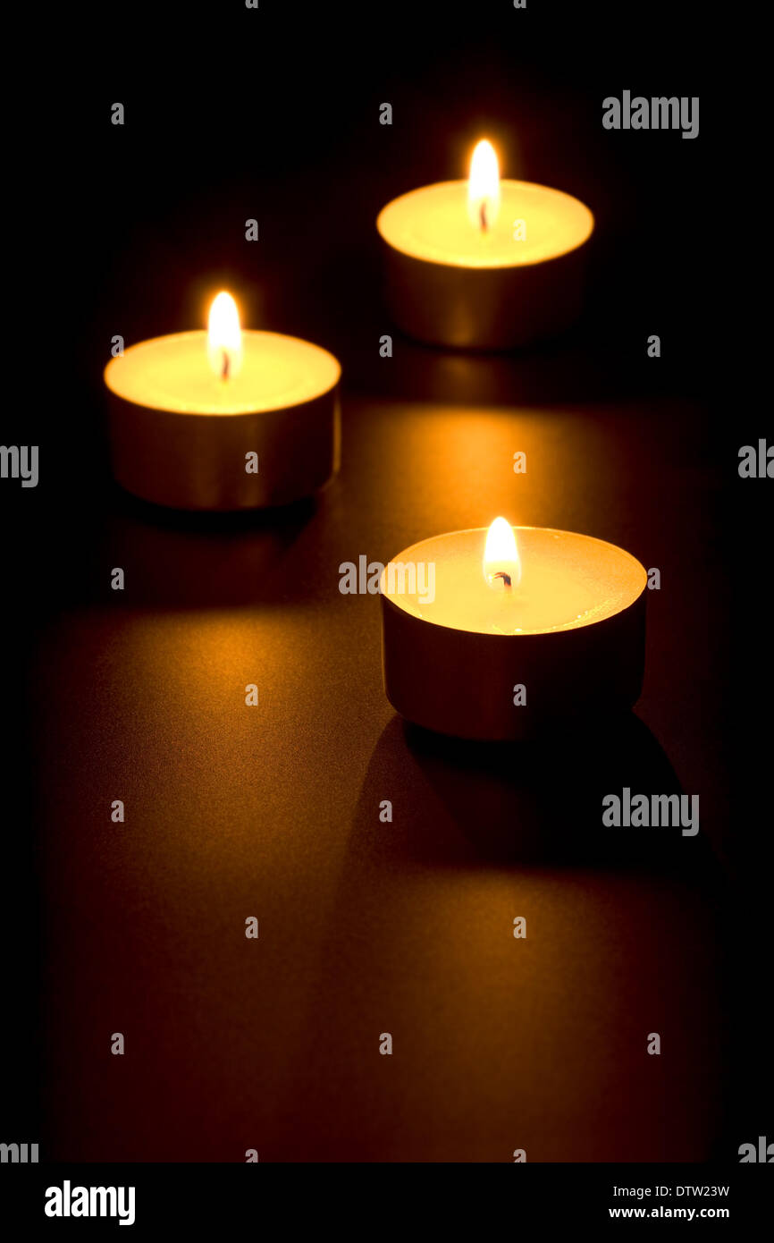 Close up three lighting candles hi-res stock photography and images - Alamy